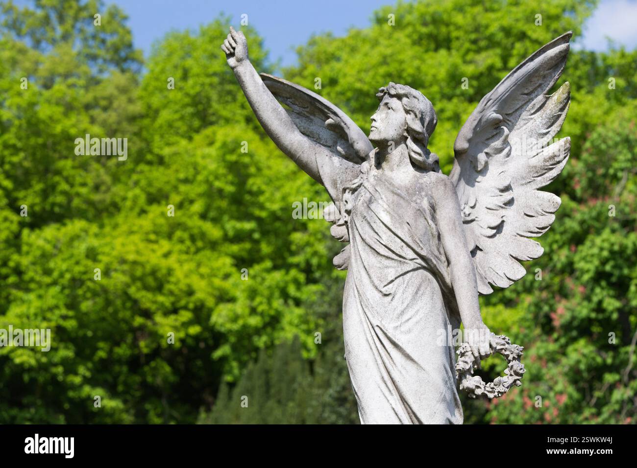 Stone angel statue, likely a memorial, at Putney Vale Cemetery and ...