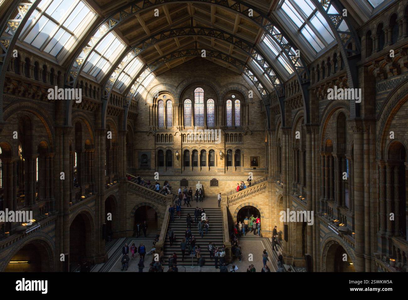 Visitors ascend the grand staircase at the Natural History Museum ...