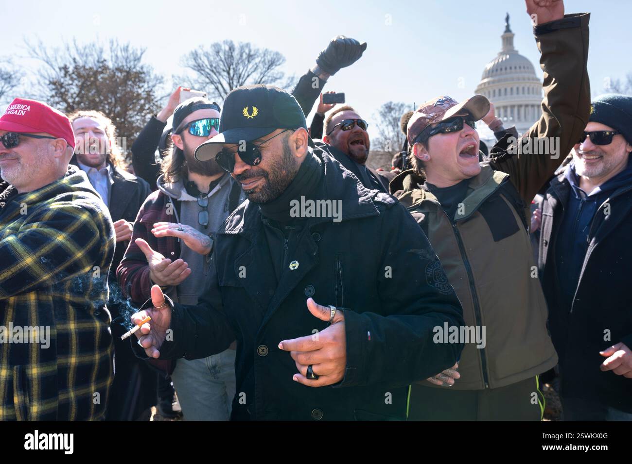 Former Proud Boys leader Enrique Tarrio, center, attends a news ...