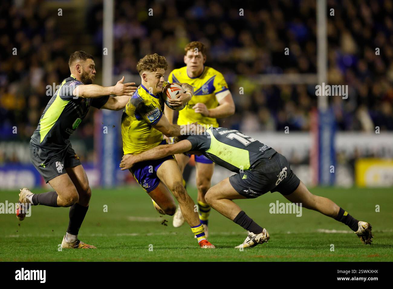 Warrington Wolves' Arron Lindop gets tackled during the Betfred Super ...