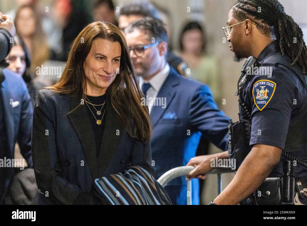 Luigi Mangione defense attorney Karen Agnifilo walks in the hallway ...