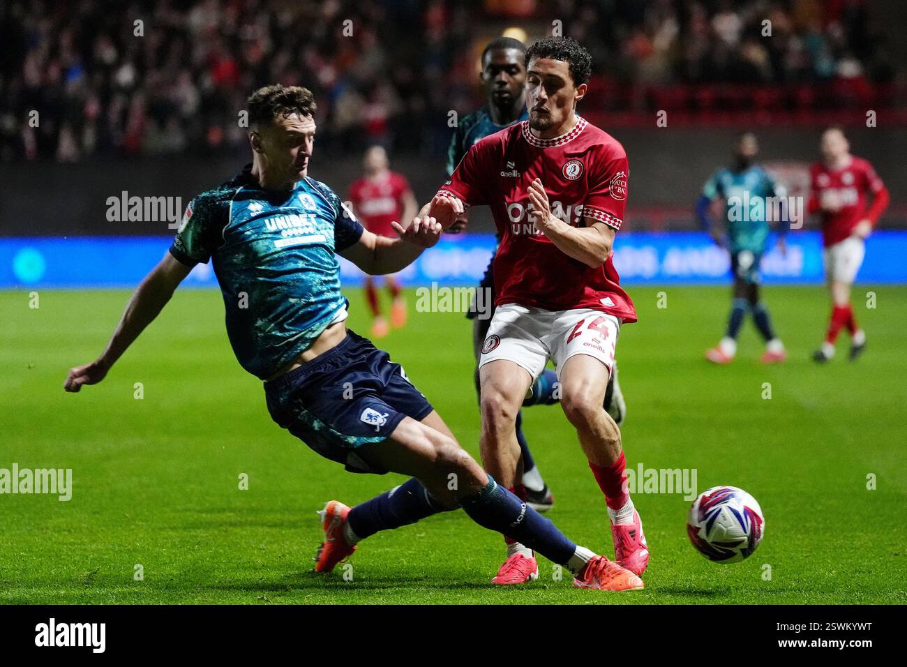 Bristol City's Haydon Roberts (right) is tackled by Middlesbrough's ...