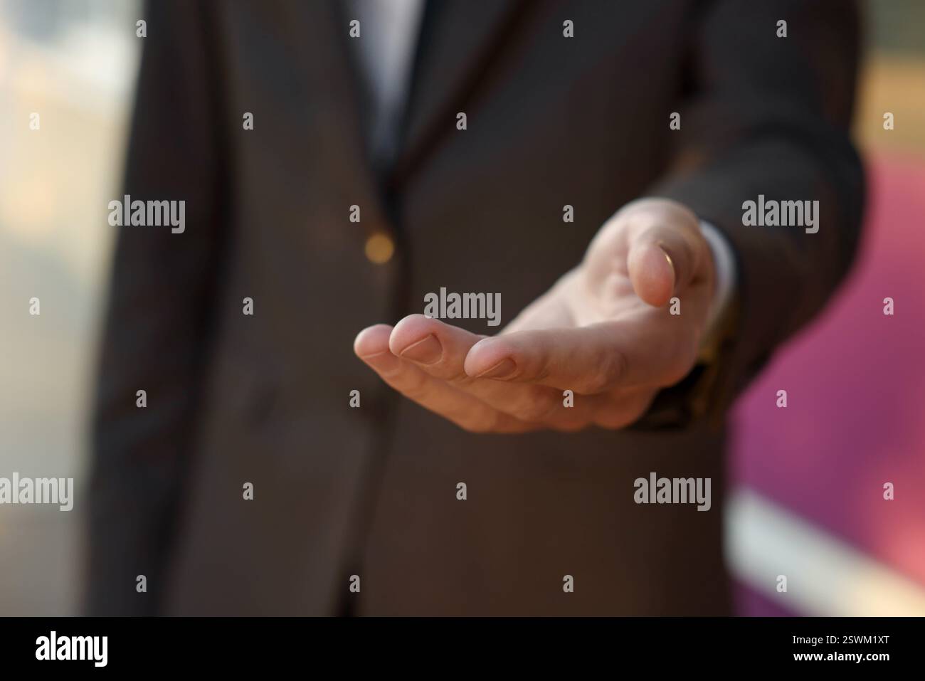 Man offering helping hand on city street, closeup Stock Photo - Alamy