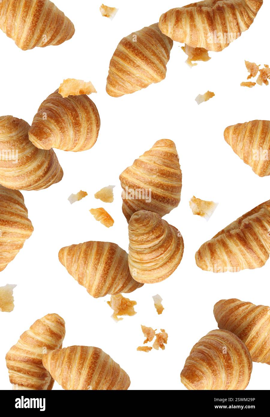 Delicious croissants and crumbs in air on white background. Puff pastry ...