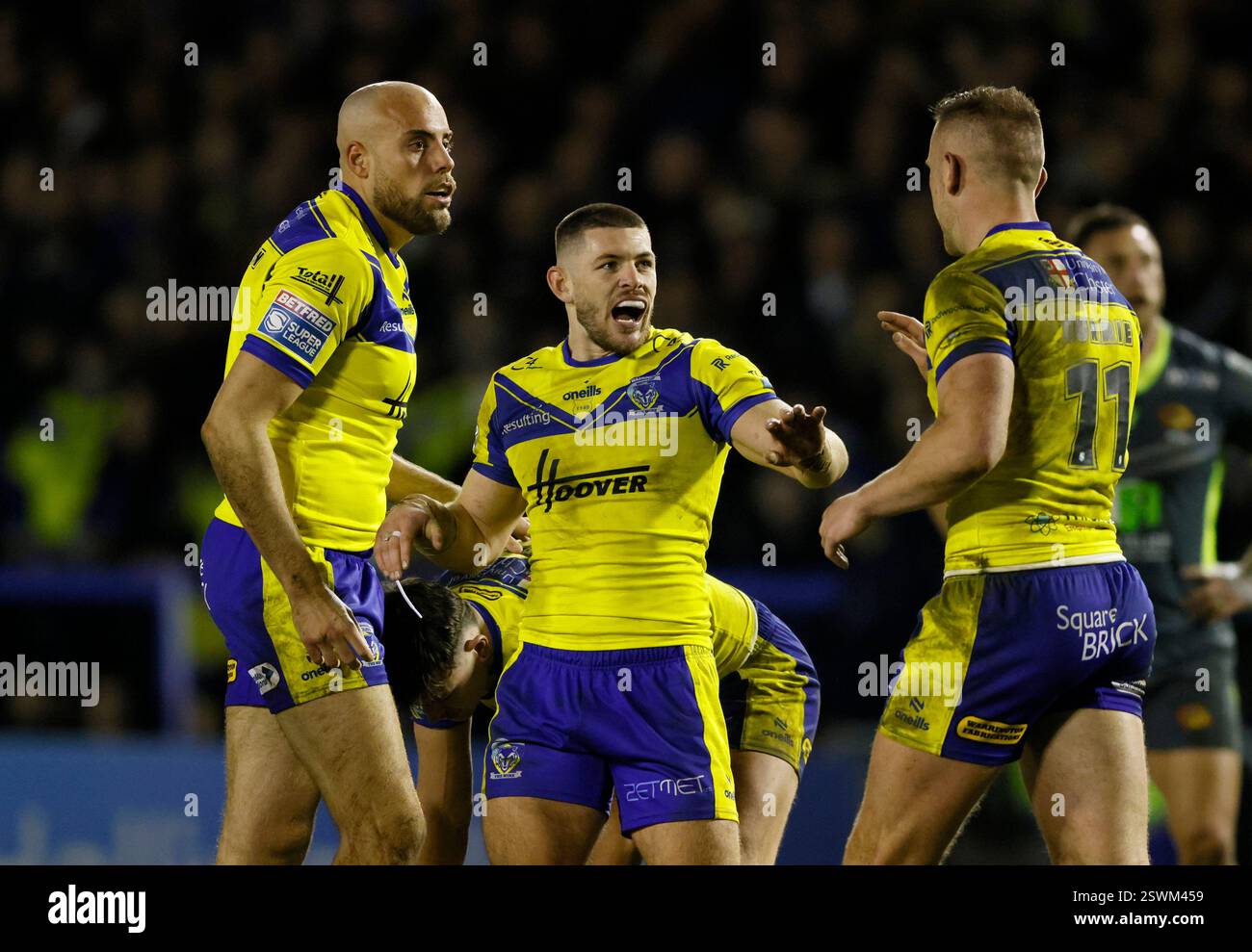 Warrington Wolves' Danny Walker (centre) celebrates with James Harrison ...