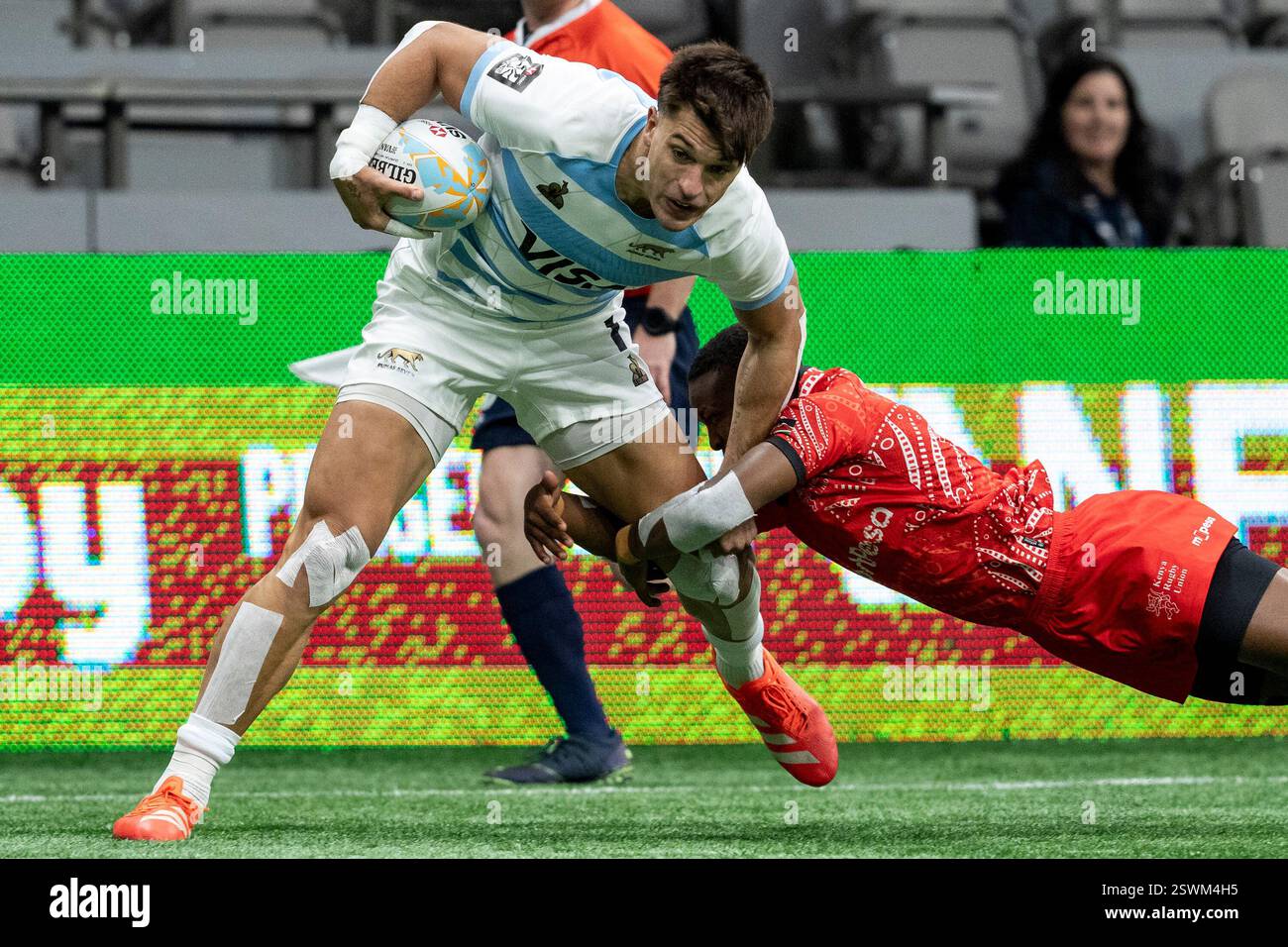 Kenya's Samuel Asati, right, tries to stop Argentina's Matteo Graziano ...