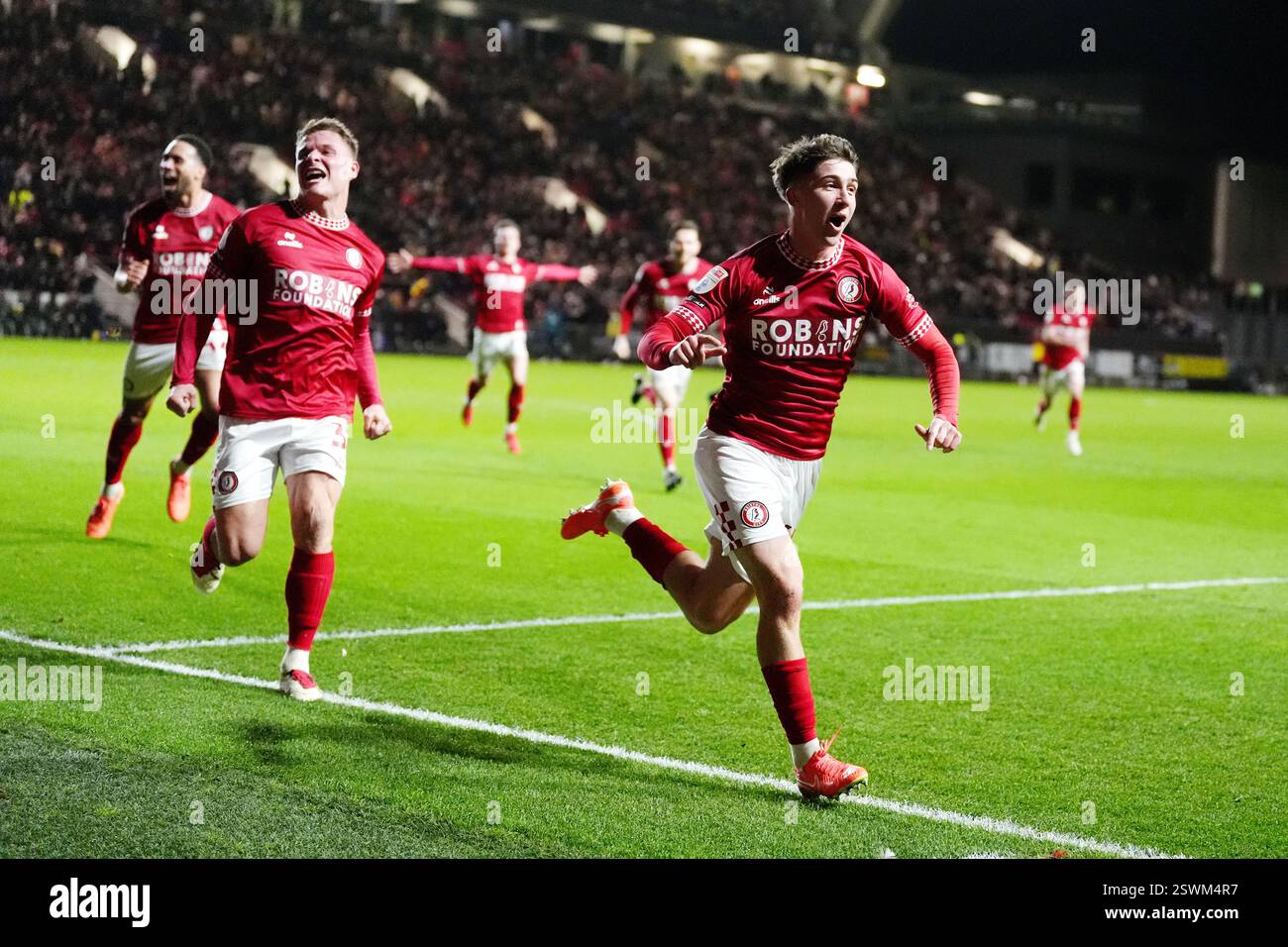 Bristol City's George Earthy (right) celebrates scoring their side's ...