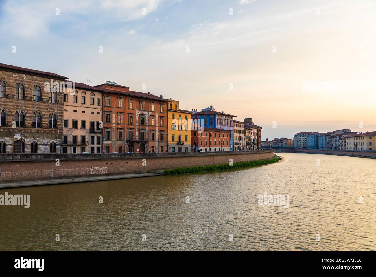 Pisa, Italy - 30 April 2024. The view of Arno river at sunset. Skyline ...