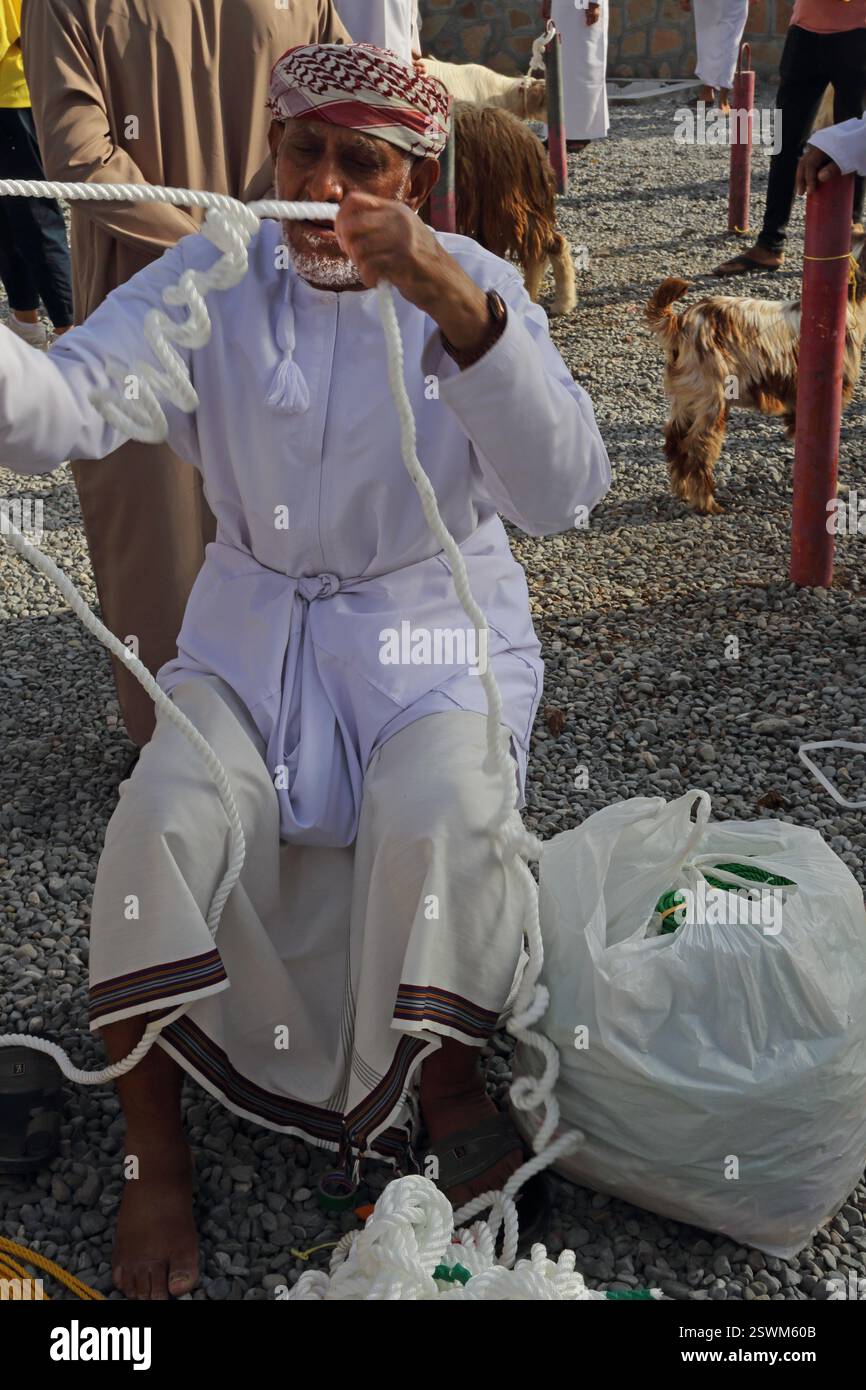Man Unravelling Rope at Nizwa Livestock Market Nizwa Oman Stock Photo ...