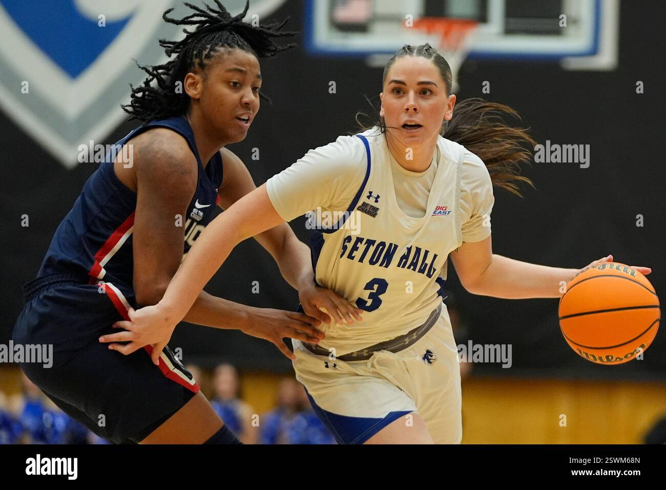 UConn's KK Arnold, left, defends Seton Hall's Faith Masonius during the ...