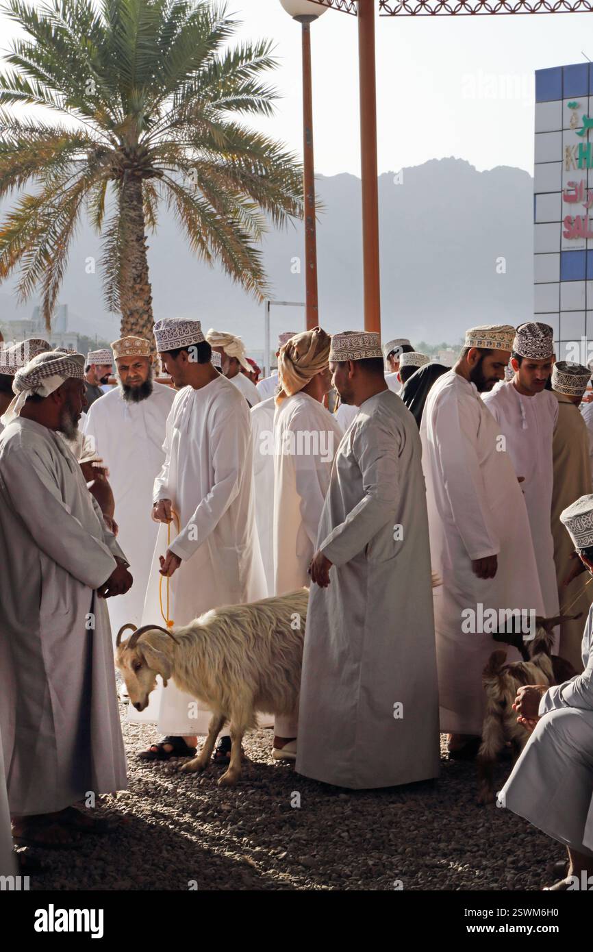 Omani Man with Goat in Crowd at Nizwa Livestock Market Nizwa Oman Stock ...