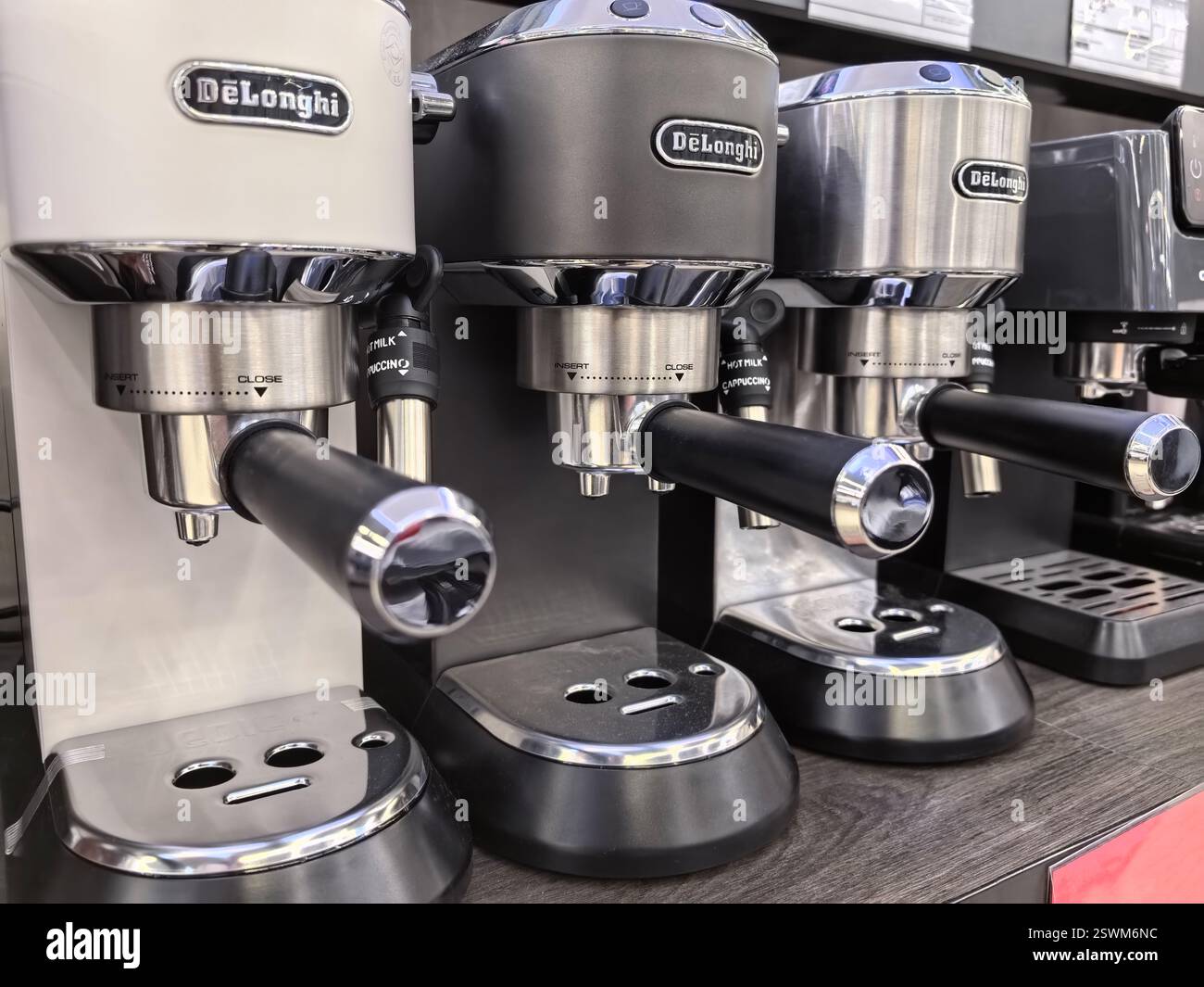 Bobruisk, Belarus - 10 February 2025: Sleek espresso machines DeLonghi ...