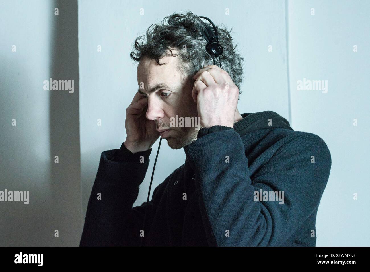 listening to audio or music with headphones on the head listening to ...