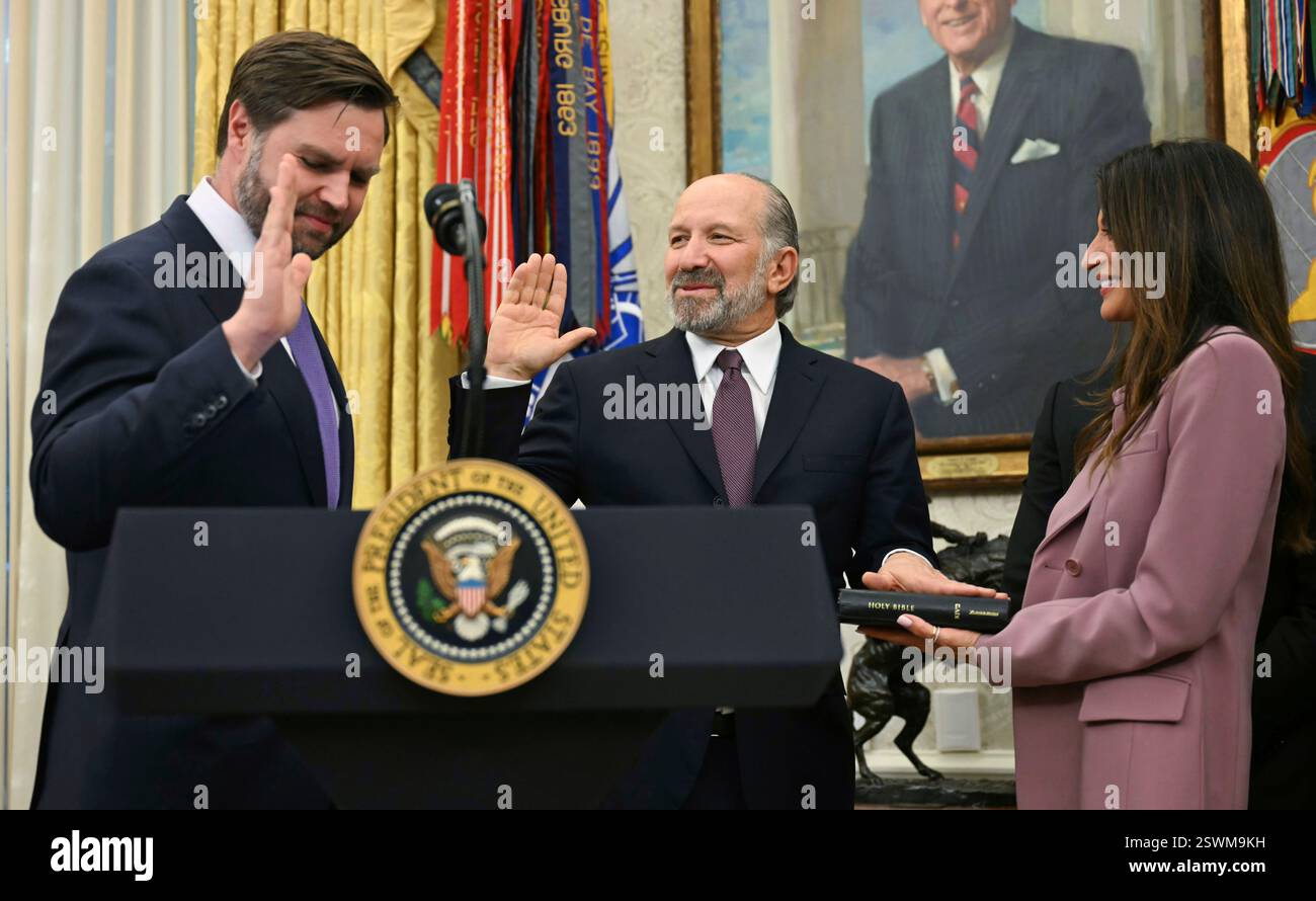 Vice President JD Vance, from left, holds up his hand during a ...