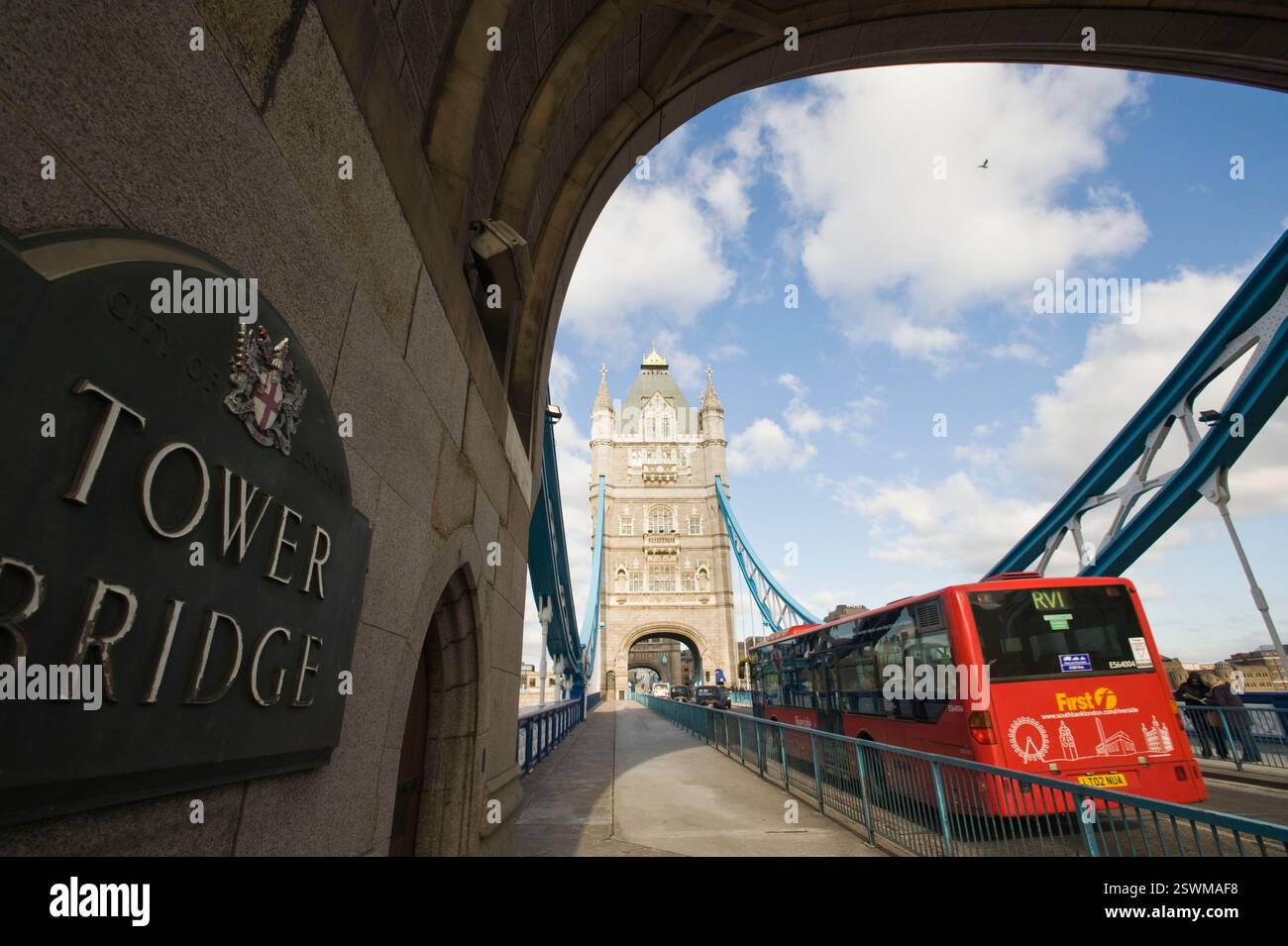 Red bus on Tower Bridge, London. A landmark in the City of London Stock ...