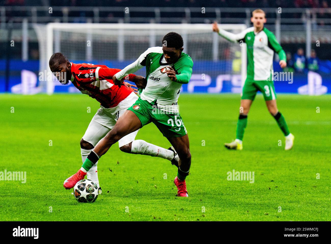 Milan, Italy. 18th Feb, 2025. Milan - Yunus Musah of AC Milan, Givairo Read of Feyenoord during ...
