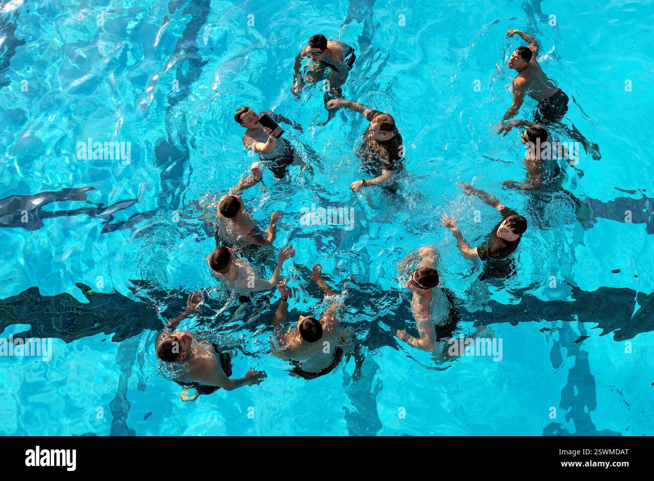 Camp Hansen, Okinawa, Japan. 18th Feb, 2025. U.S. Marines hold a brick ...