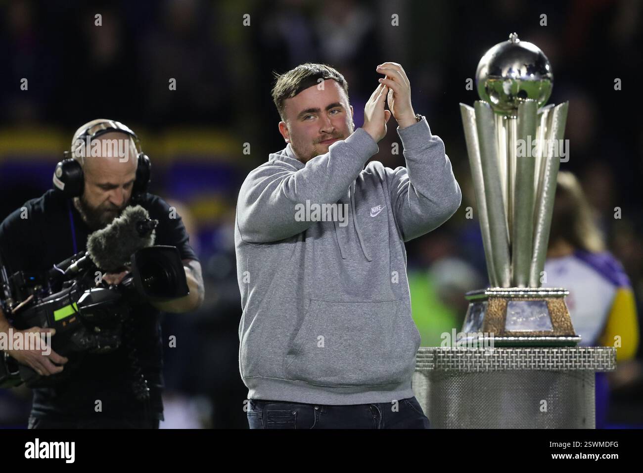 Luke Littler applauds the home fans during the Betfred Super League ...
