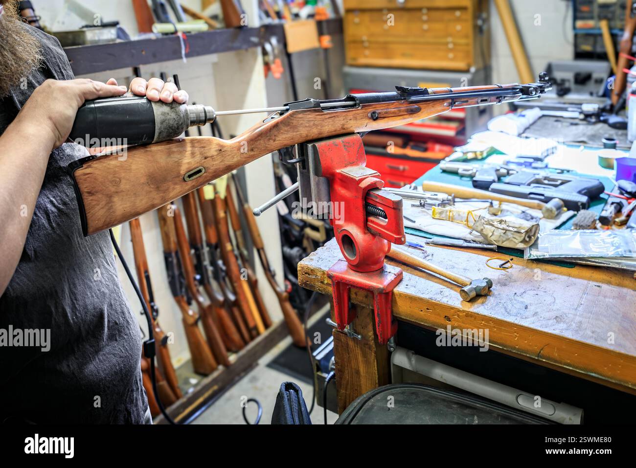 California gunsmith repairs a Mosin Nagant rifle with a wooden stock ...