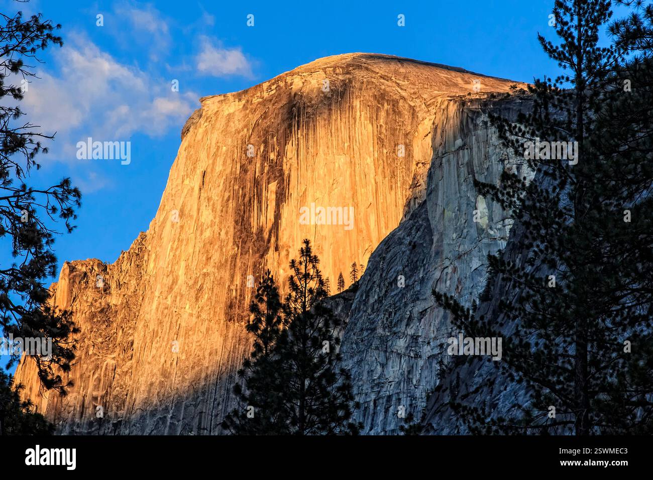 Mountain with a large peak and a shadow on it. The shadow is on the ...