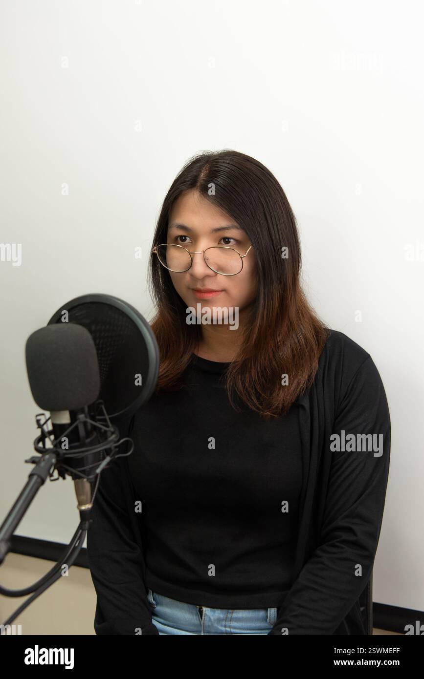 Beautiful asian woman (LGBTQ) is a singer. She enjoying sing a song or ...