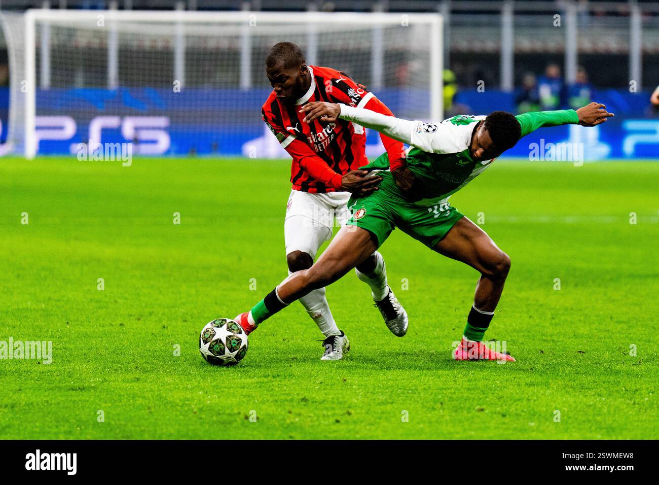 Milan, Italy. 18th Feb, 2025. Milan - Yunus Musah of AC Milan, Givairo Read of Feyenoord during ...