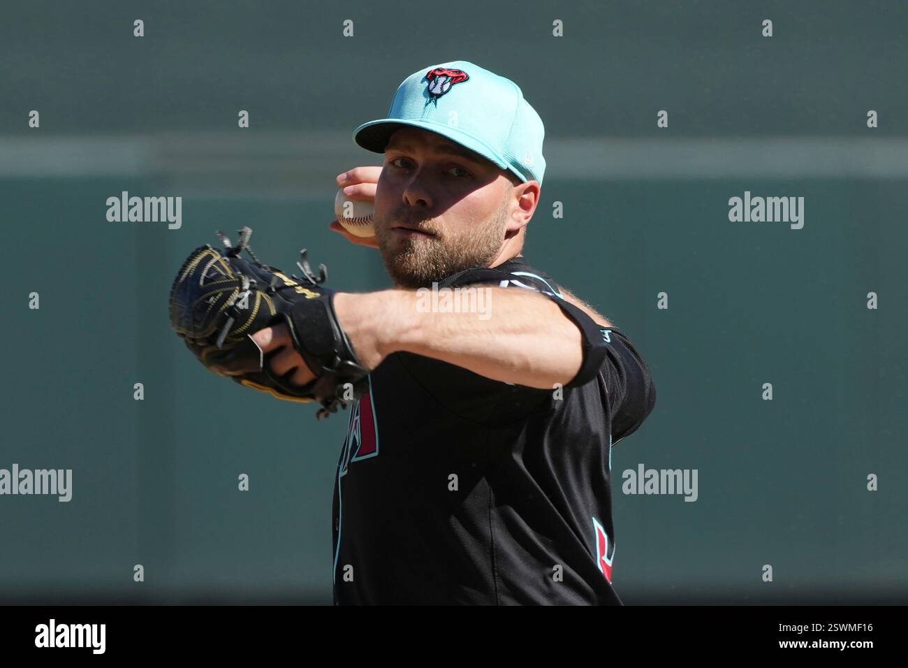 Arizona Diamondbacks pitcher Corbin Burnes warms up prior to a spring ...