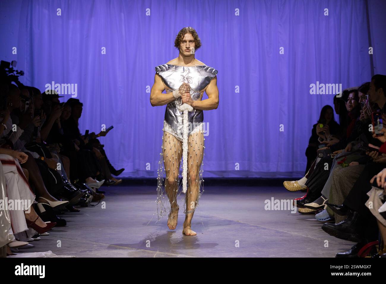 London, UK. Friday February 21, 2025. Models on the catwalk at the Di ...