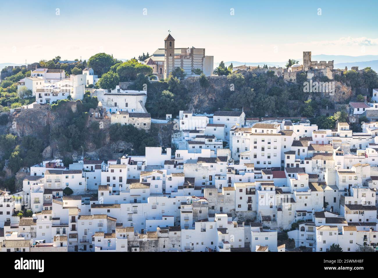 A stunning view of a village nestled on a hillside, showcasing its ...