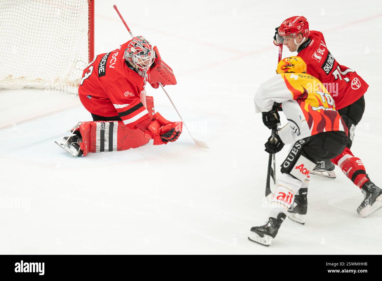 Lausanne, Switzerland. , . Kevin Pasche (goalkeeper) of Lausanne HC #33 makes a stop against ...