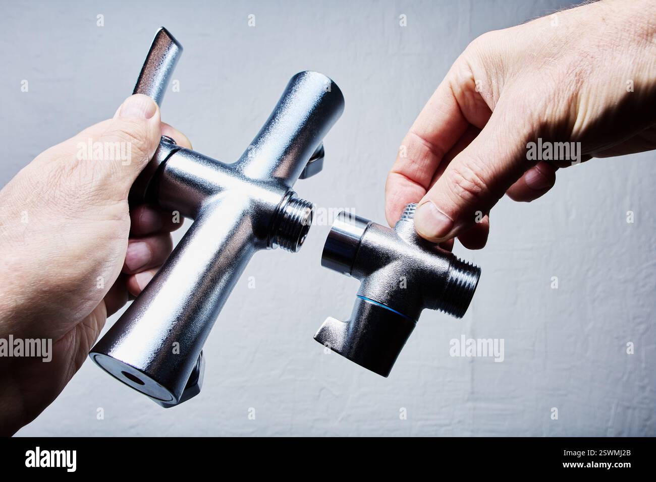 Control handles and shower faucet combo being assembled, highlighting ...