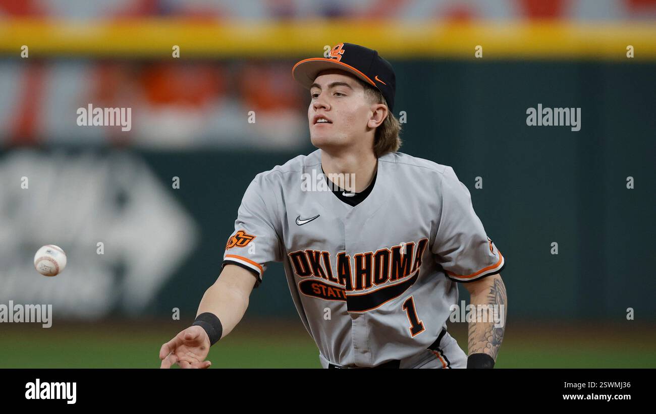 Oklahoma State infielder Brock Thompson (1) tosses the ball to a teammate during an NCAA ...
