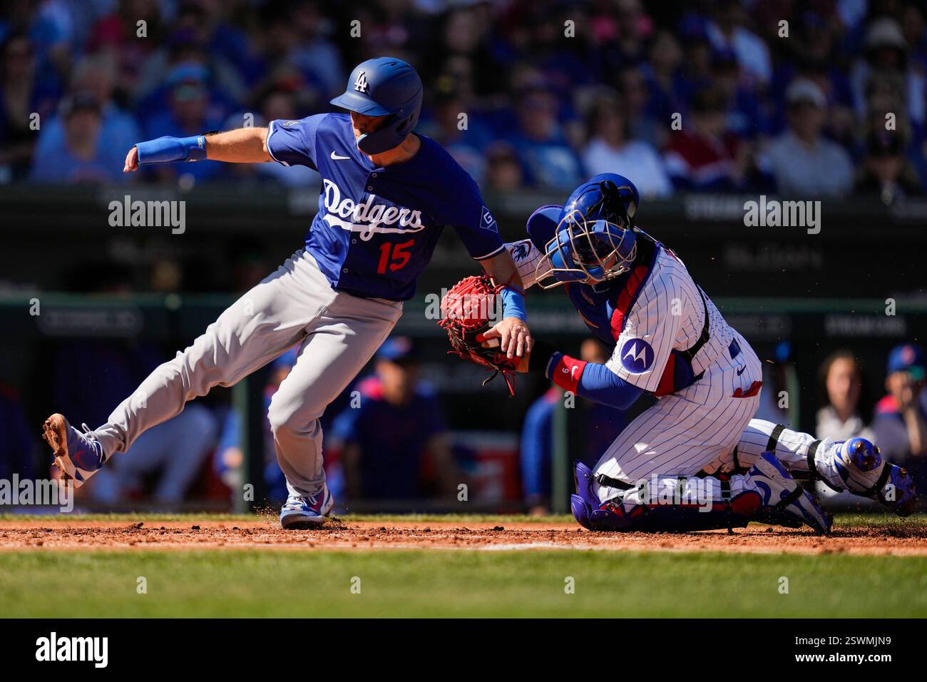 Los Angeles Dodgers' Austin Barnes is tagged out at home by Chicago ...