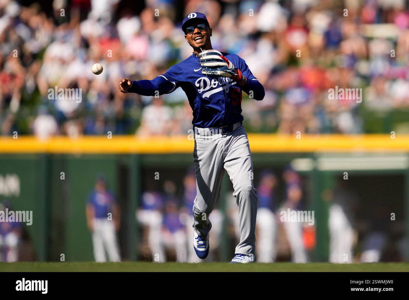 Los Angeles Dodgers shortstop Mookie Betts throws to first to out ...