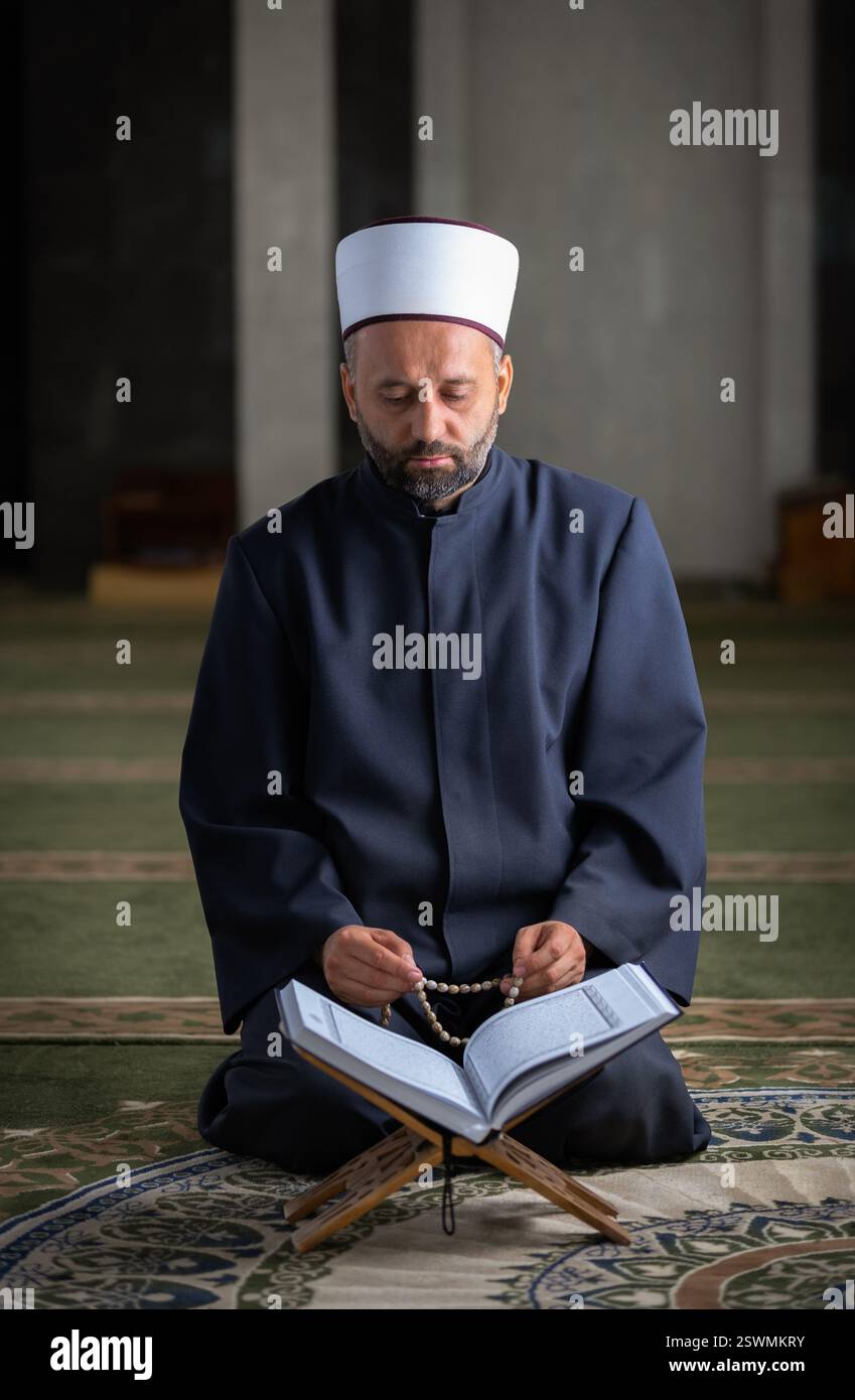 A Muslim man prayer praying inside the mosque Stock Photo - Alamy