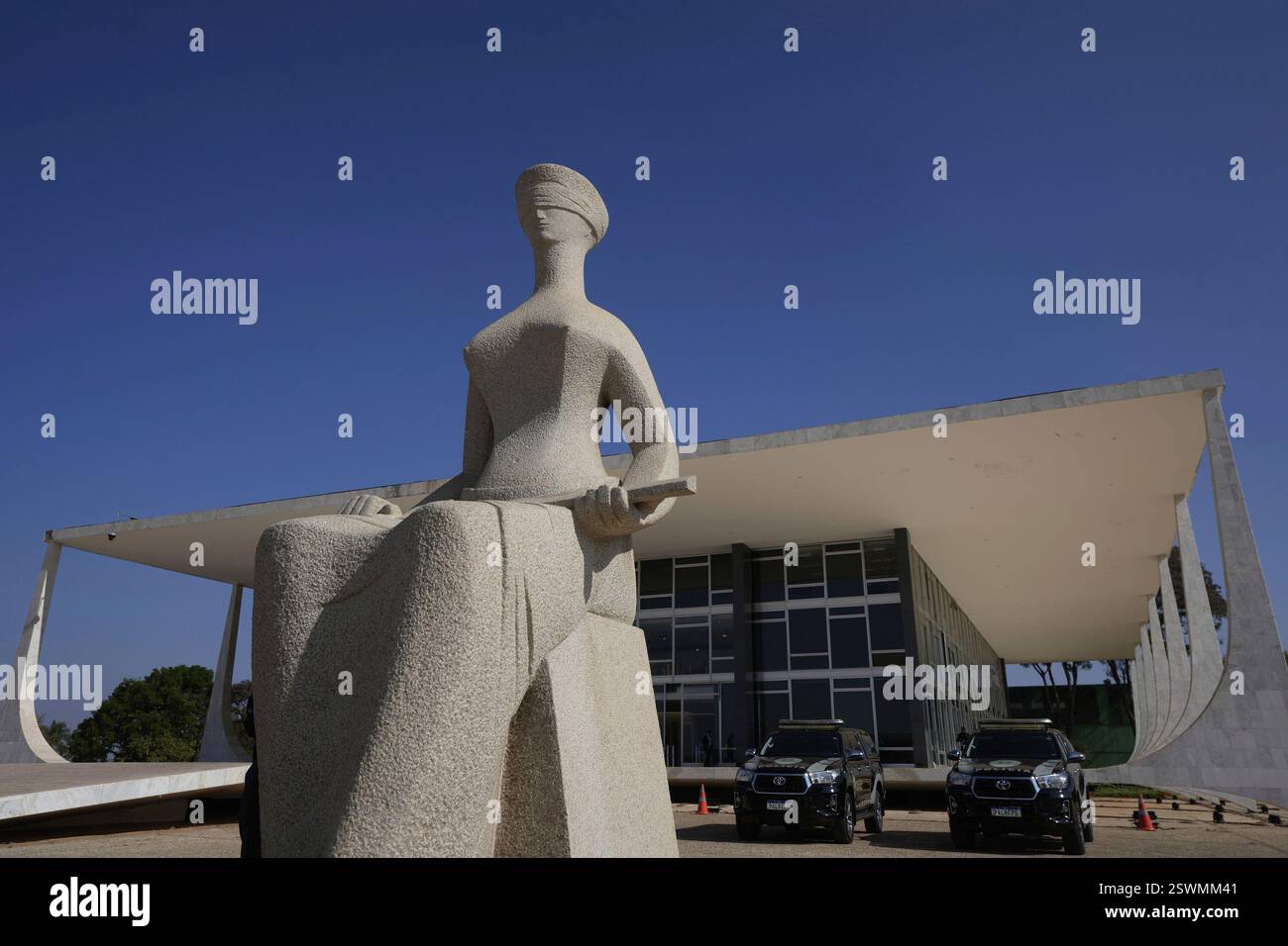 FILE - Lady Justice statue, depicting a seated, blindfolded woman ...