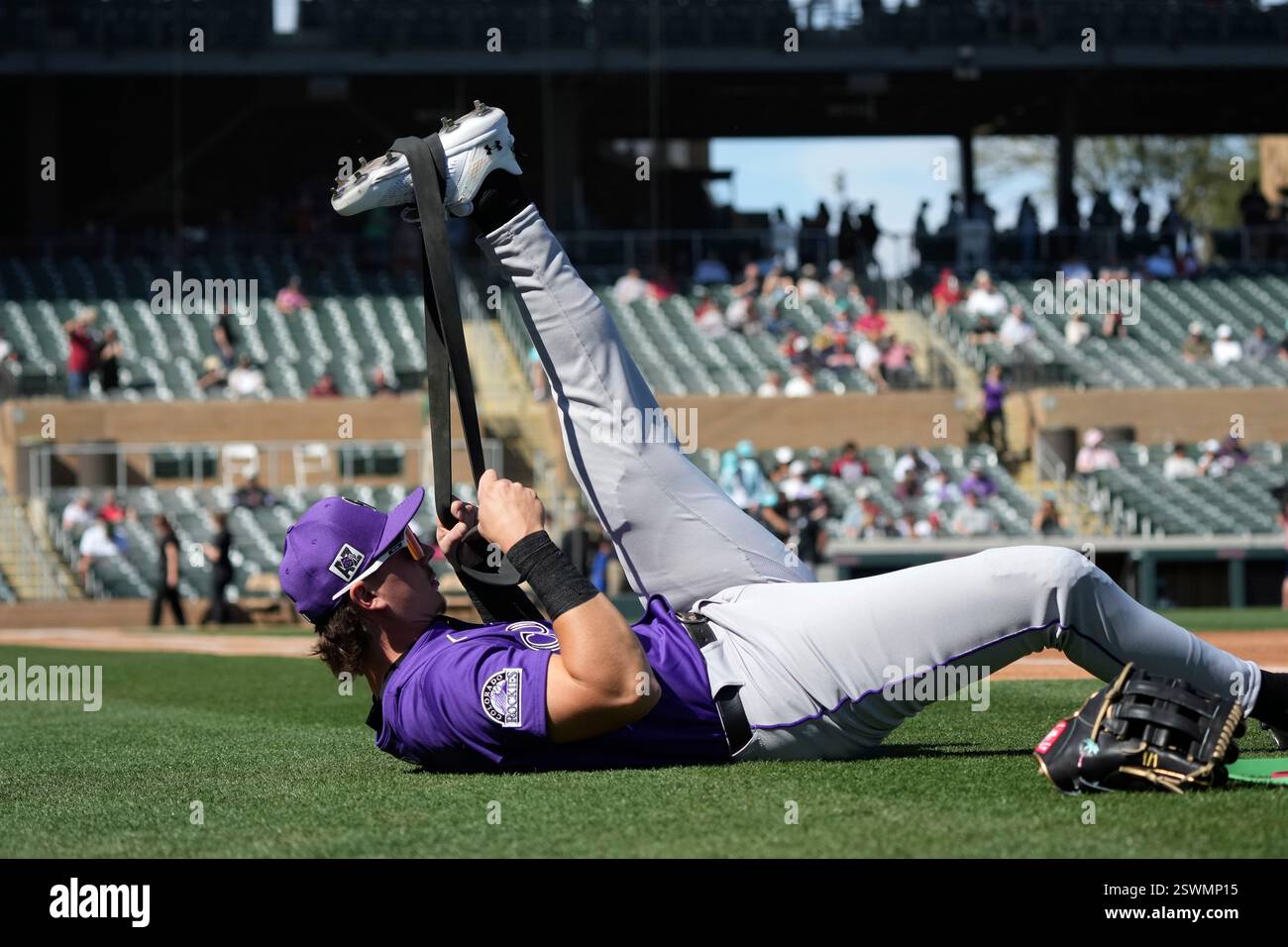 Colorado Rockies' Jordan Beck stretches prior to a spring training ...