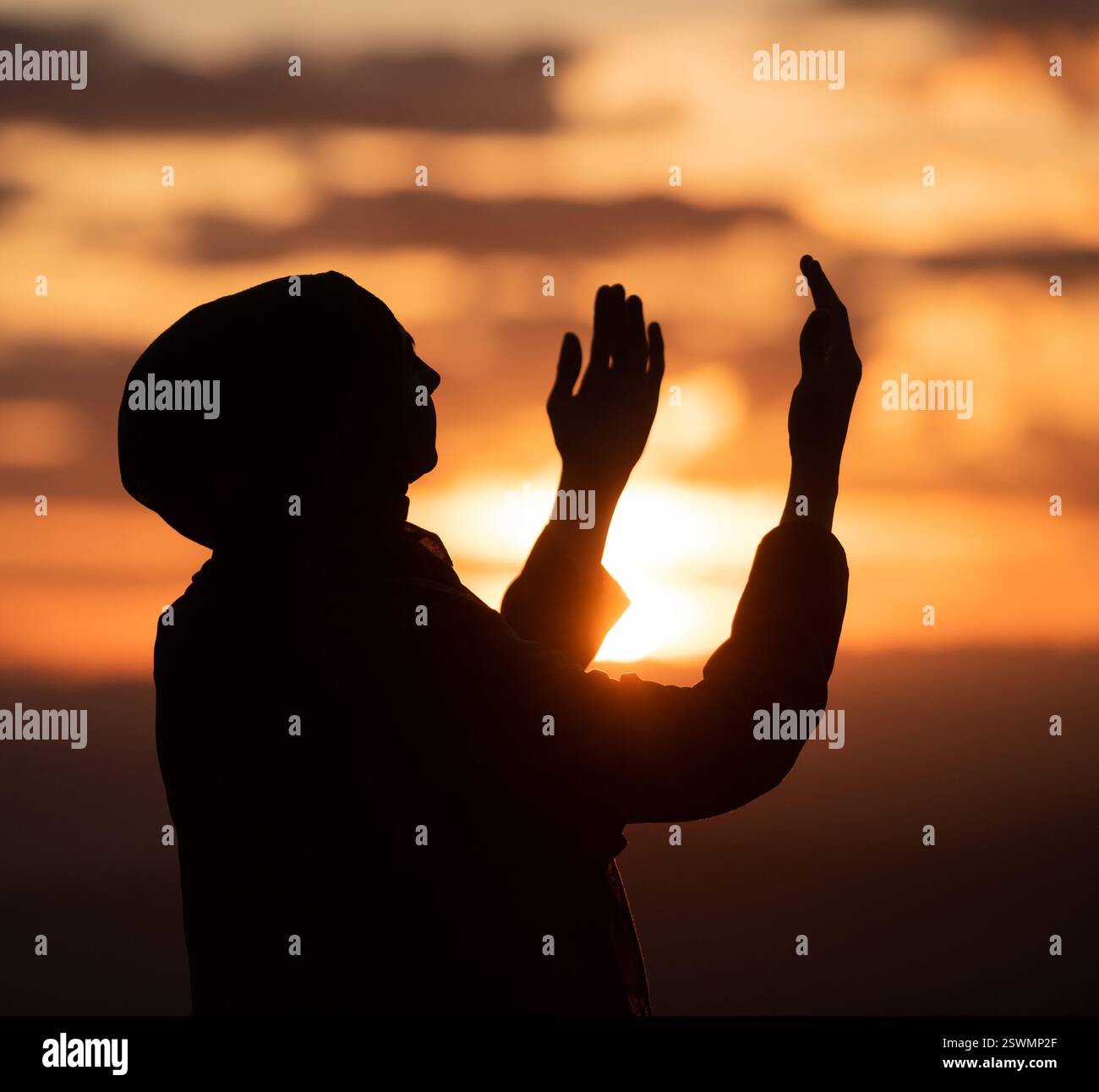 Muslim woman prayer praying with hands up open doing dua worship Allah ...