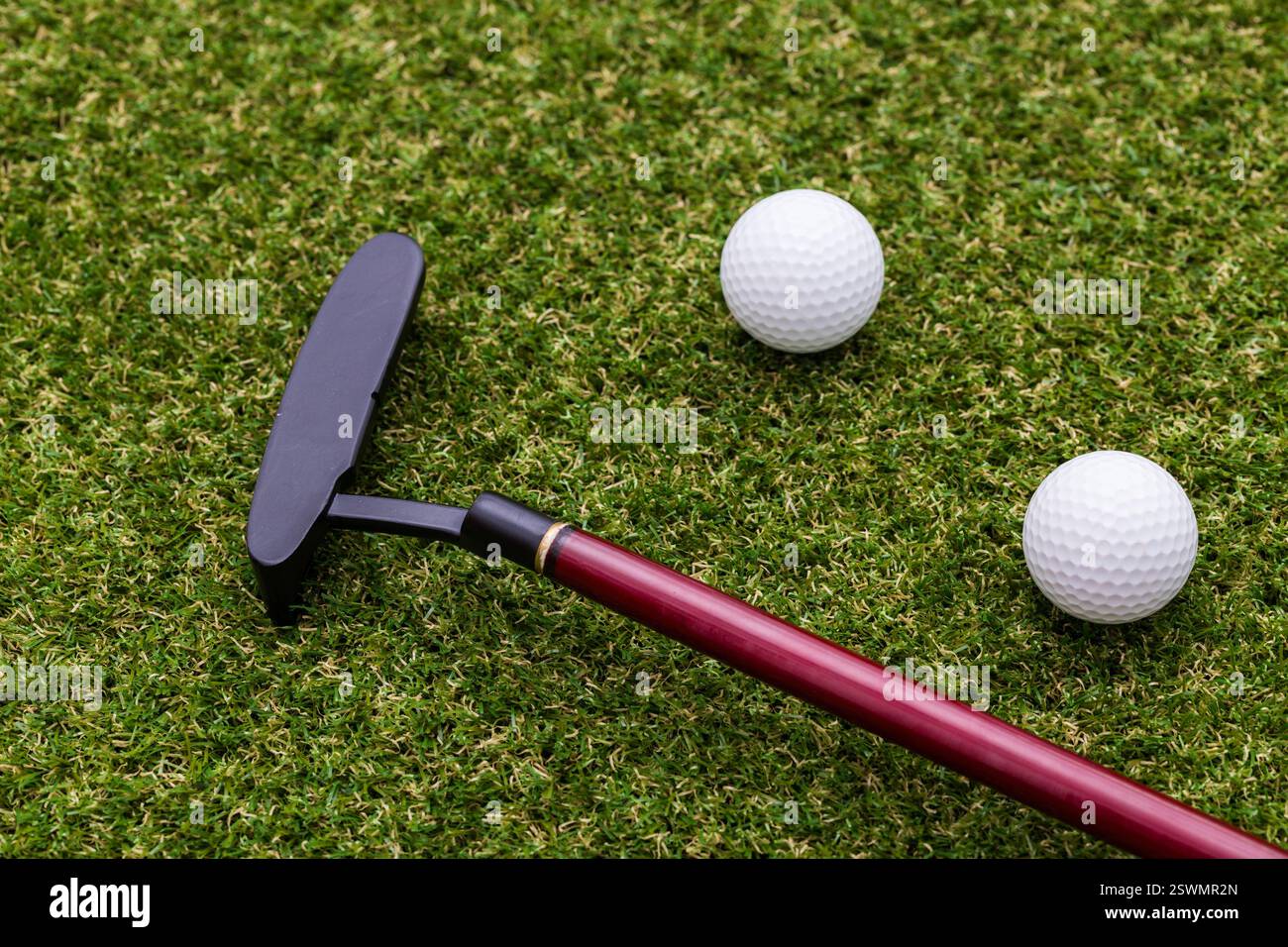 Indoor mini golf equipment set on green grass background Stock Photo ...
