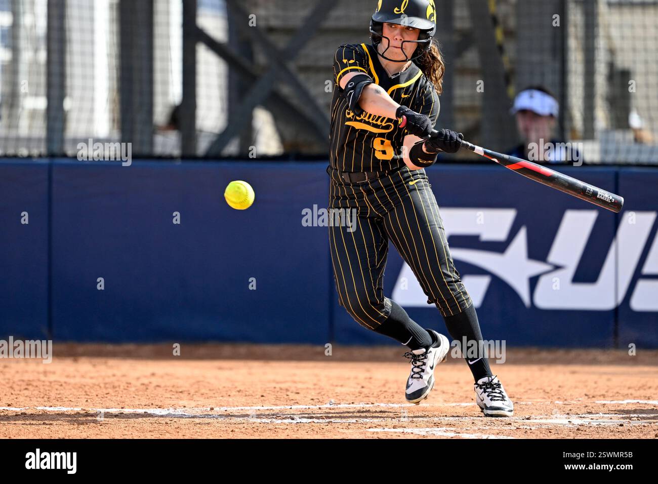 Iowa outfielder Tatianna Roman (9) bats during an NCAA softball game ...