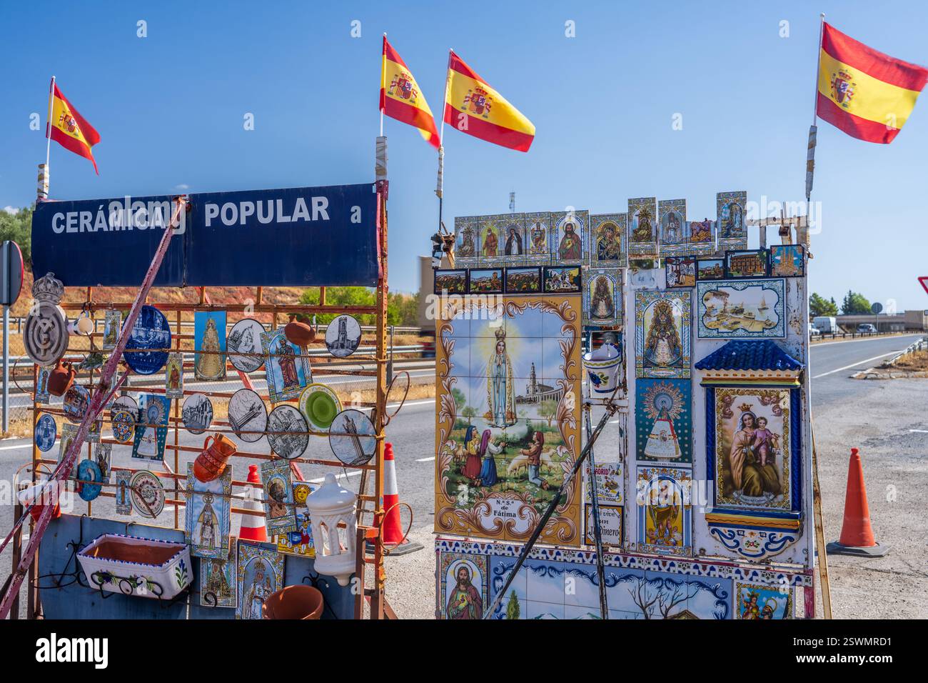 Outdoor ceramics booth showcasing Spanish handcrafts and religious tile ...
