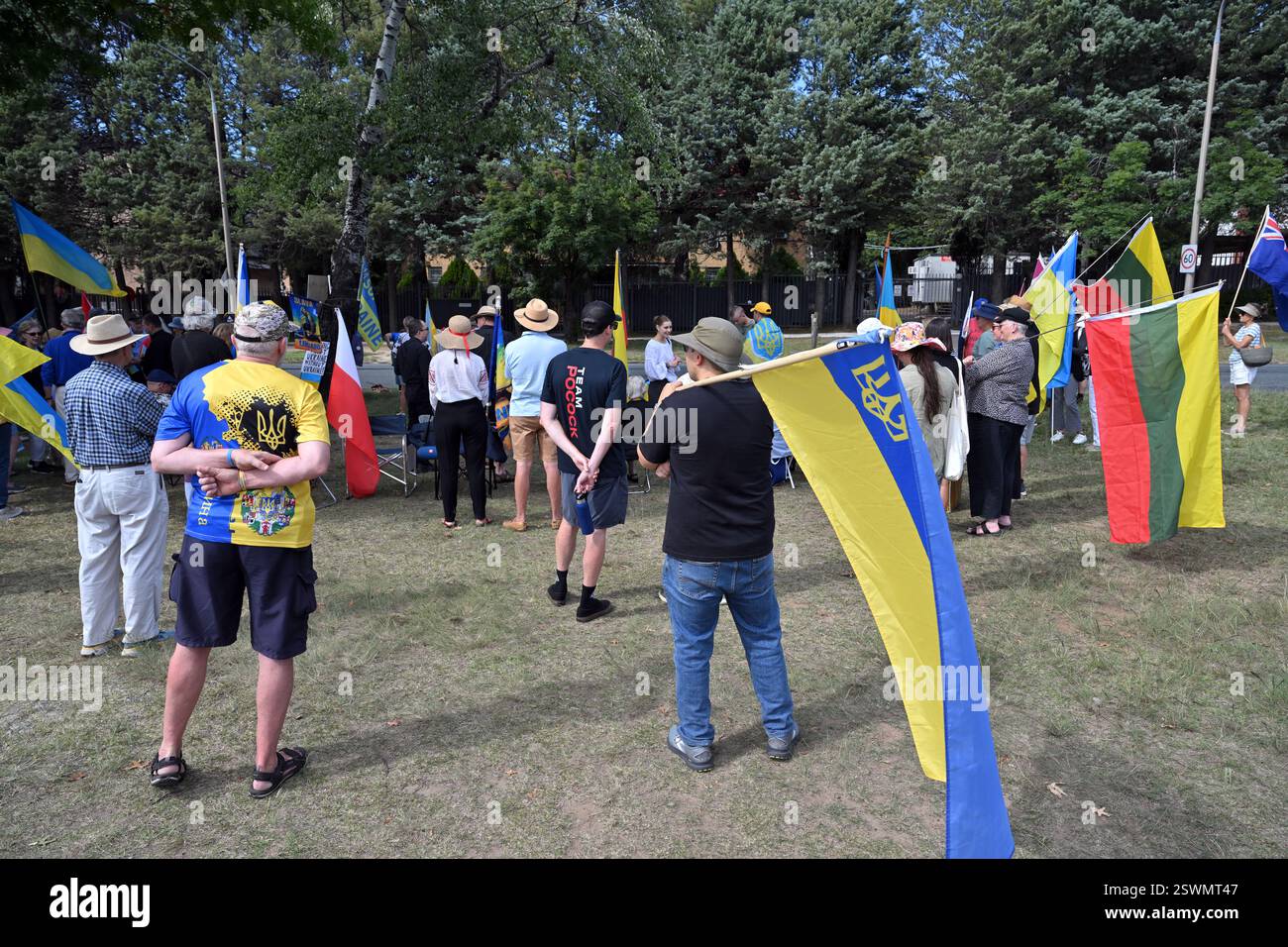 Canberra, Australia. 22nd Feb, 2025. Protesters wave Ukrainian flags ...