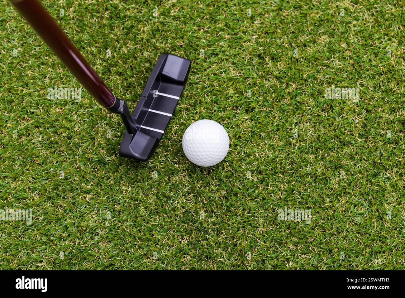 Indoor mini golf equipment set on green grass background Stock Photo ...