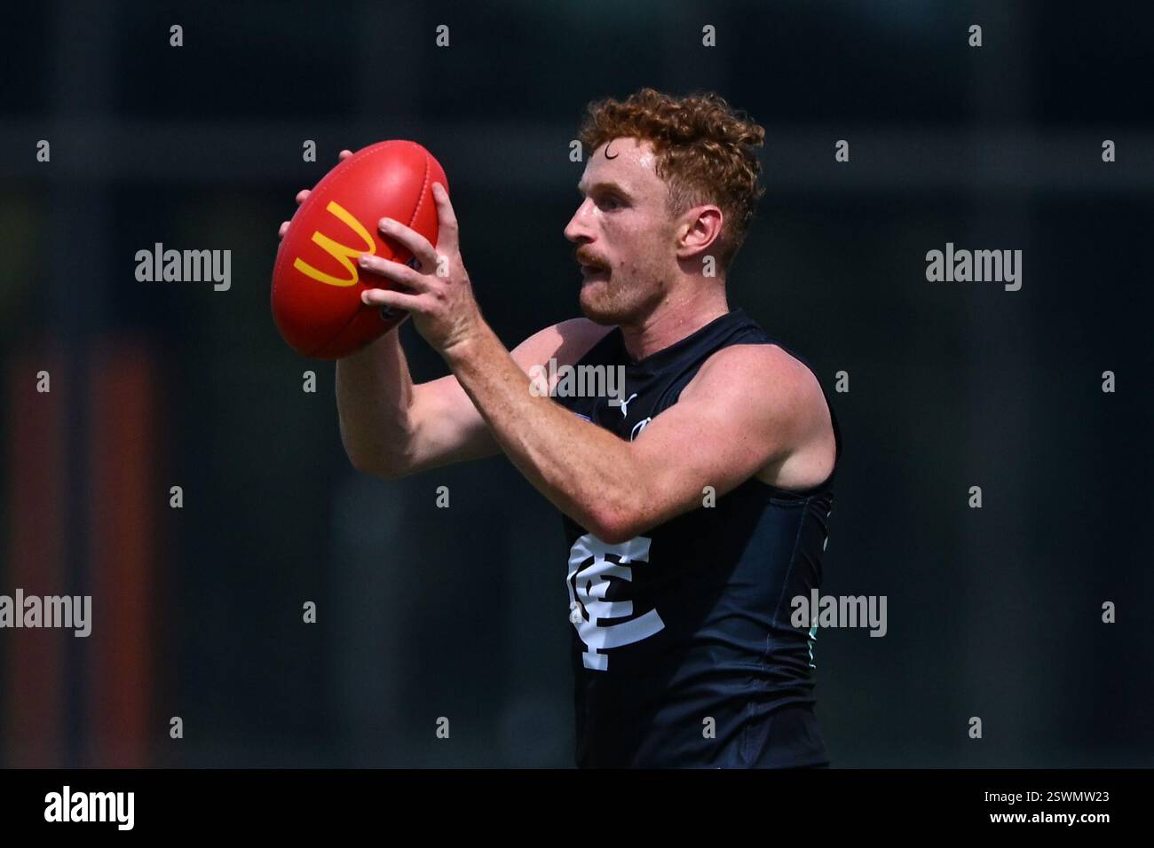 Melbourne, Australia. 22nd Feb, 2025. Matthew Cottrell of Carlton marks ...