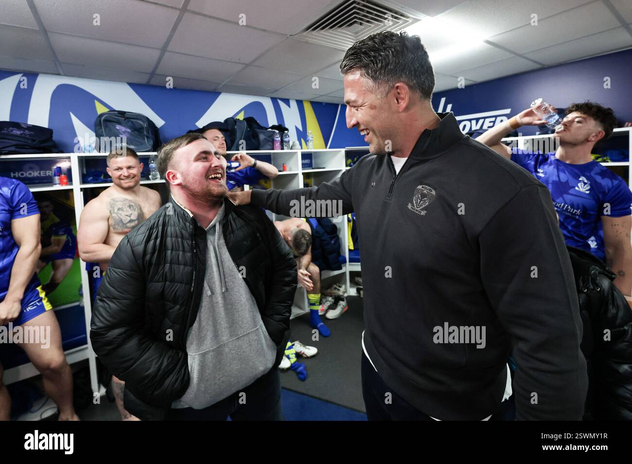 Warrington, UK. 21st Feb, 2025. Luke Littler meets Sam Burgess Head ...