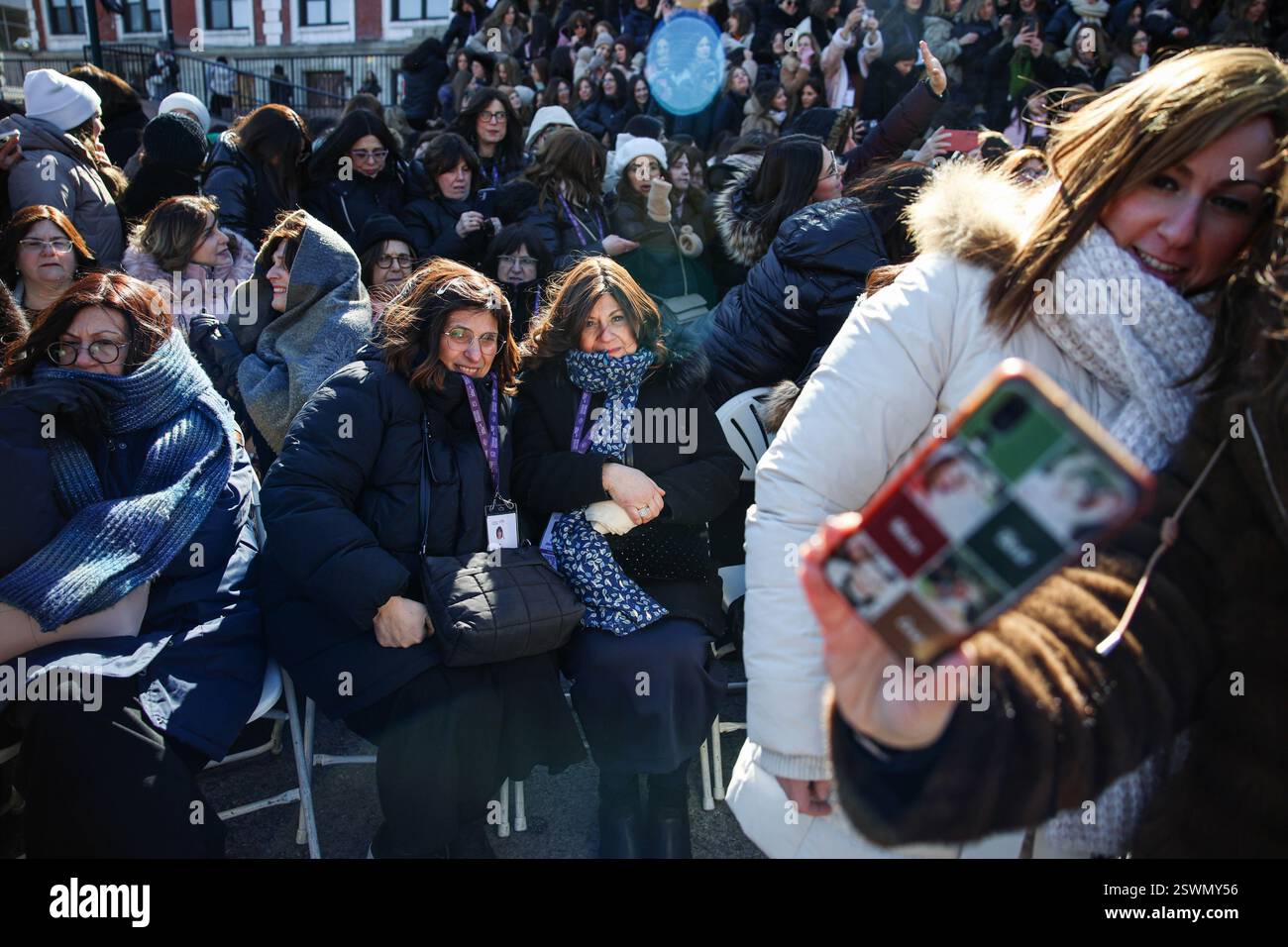 New York, New York, USA. 21st Feb, 2025. Women smile at the camera as ...