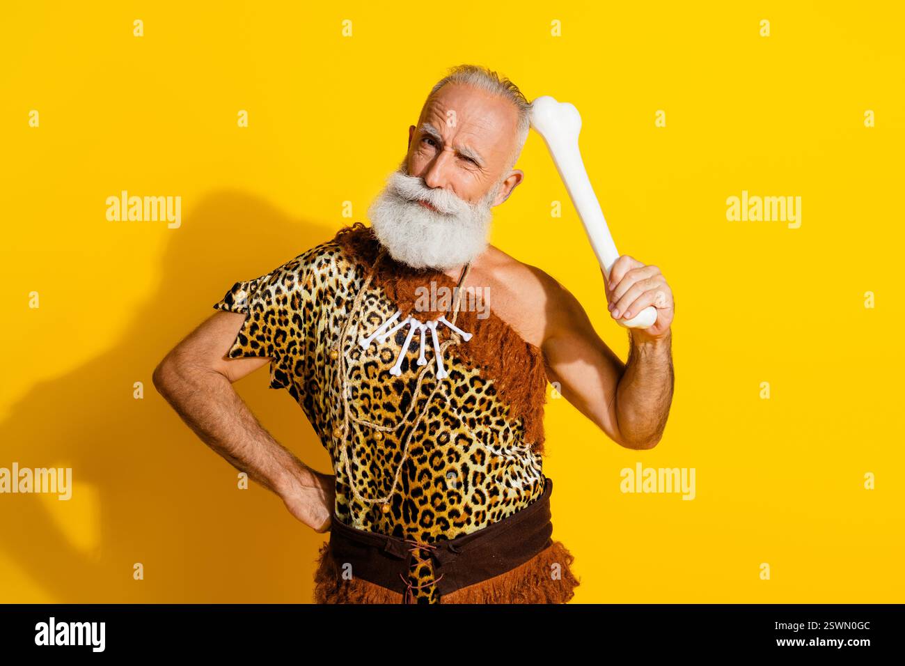 Photo of doubtful unsure barbarian guy dressed leopard fur holding ...