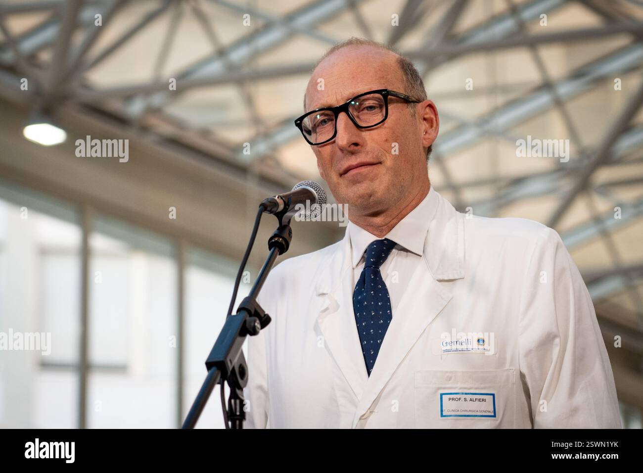 The surgeon Dr. Sergio Alfieri speaks to reporters in the lobby of the ...