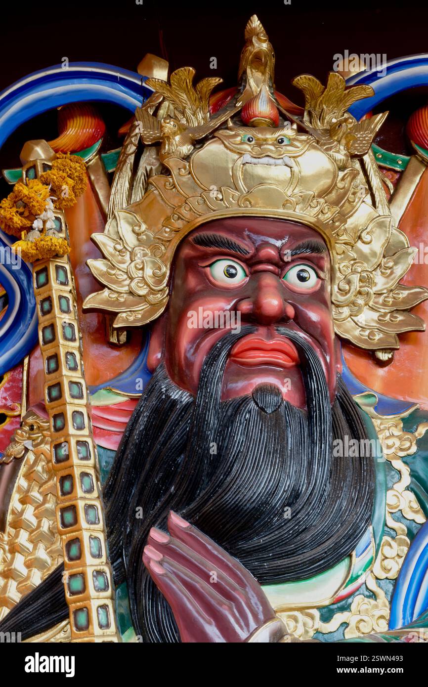 The image of an Emperor God on the entrance door to Chinese-Taoist Thye ...