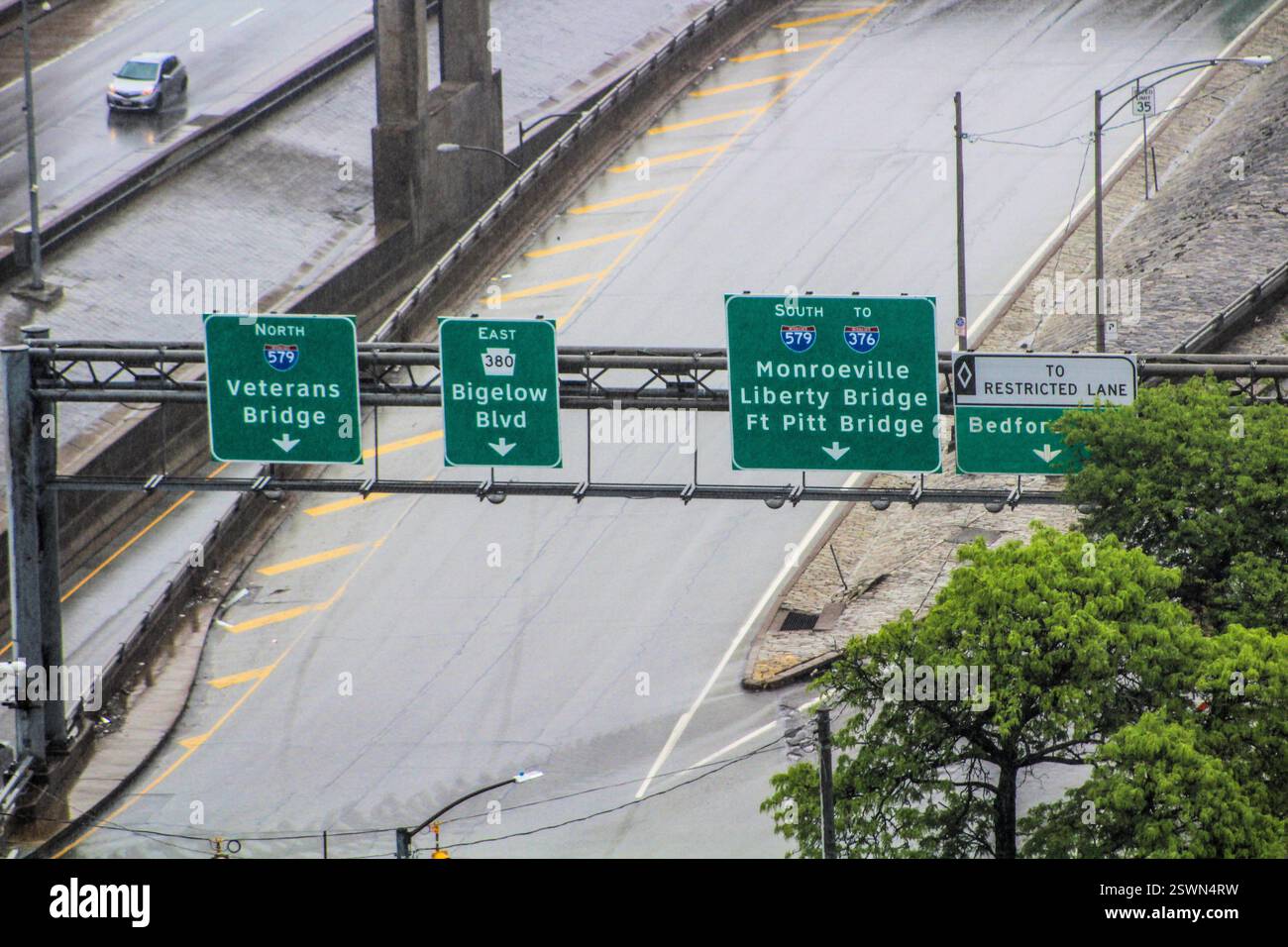 Traffic signs guide vehicles toward significant Pittsburgh bridges and ...